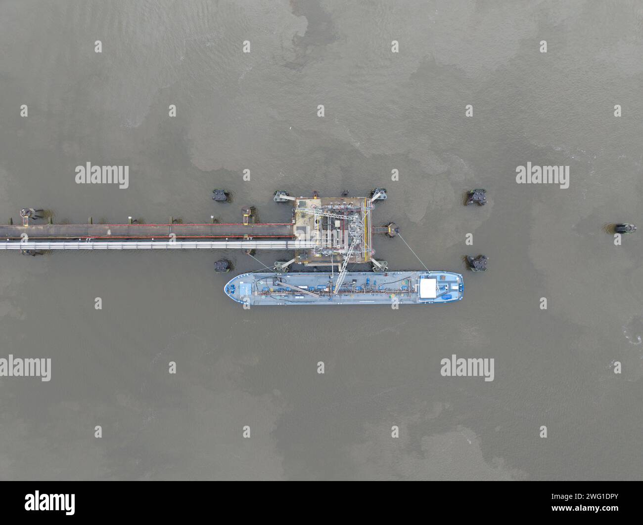 top down view on a inland shipping bulk carrier docked moored at a ...