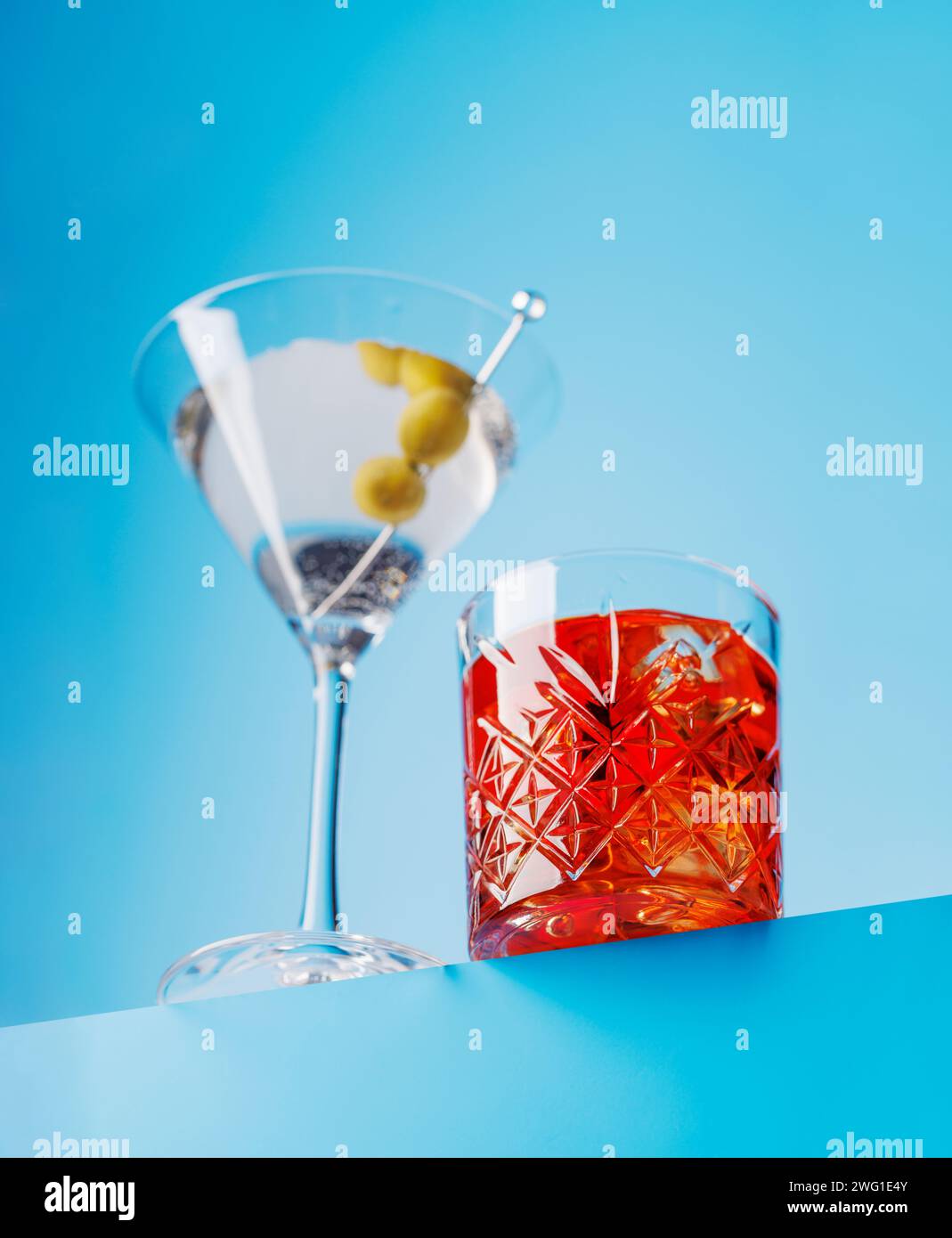 Cocktail delight: Vibrant drinks against a cool blue background with ...