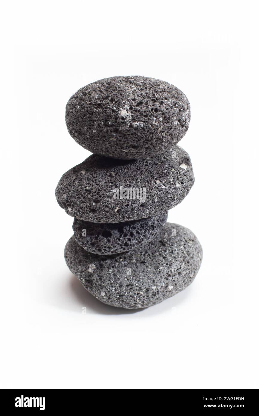 balancing volcanic rocks isolated on white background Stock Photo - Alamy