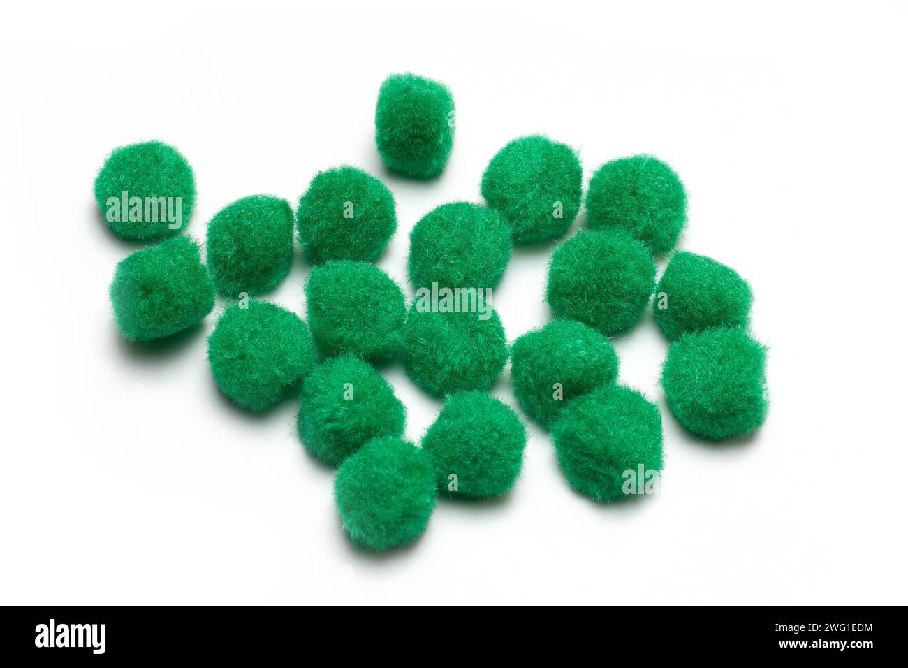 small fluffy green balls isolated on white background Stock Photo - Alamy