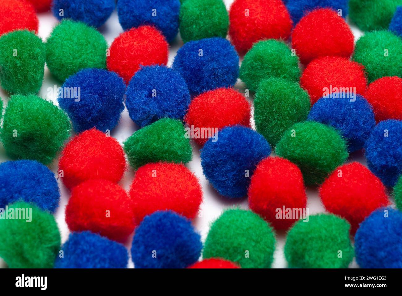 small fluffy balls isolated on white background Stock Photo - Alamy