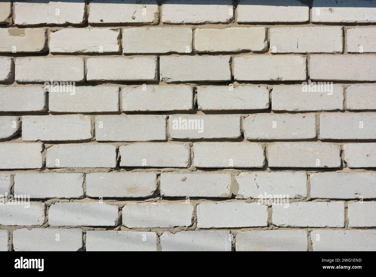 Construction, building materials, white brick and grey cement building ...