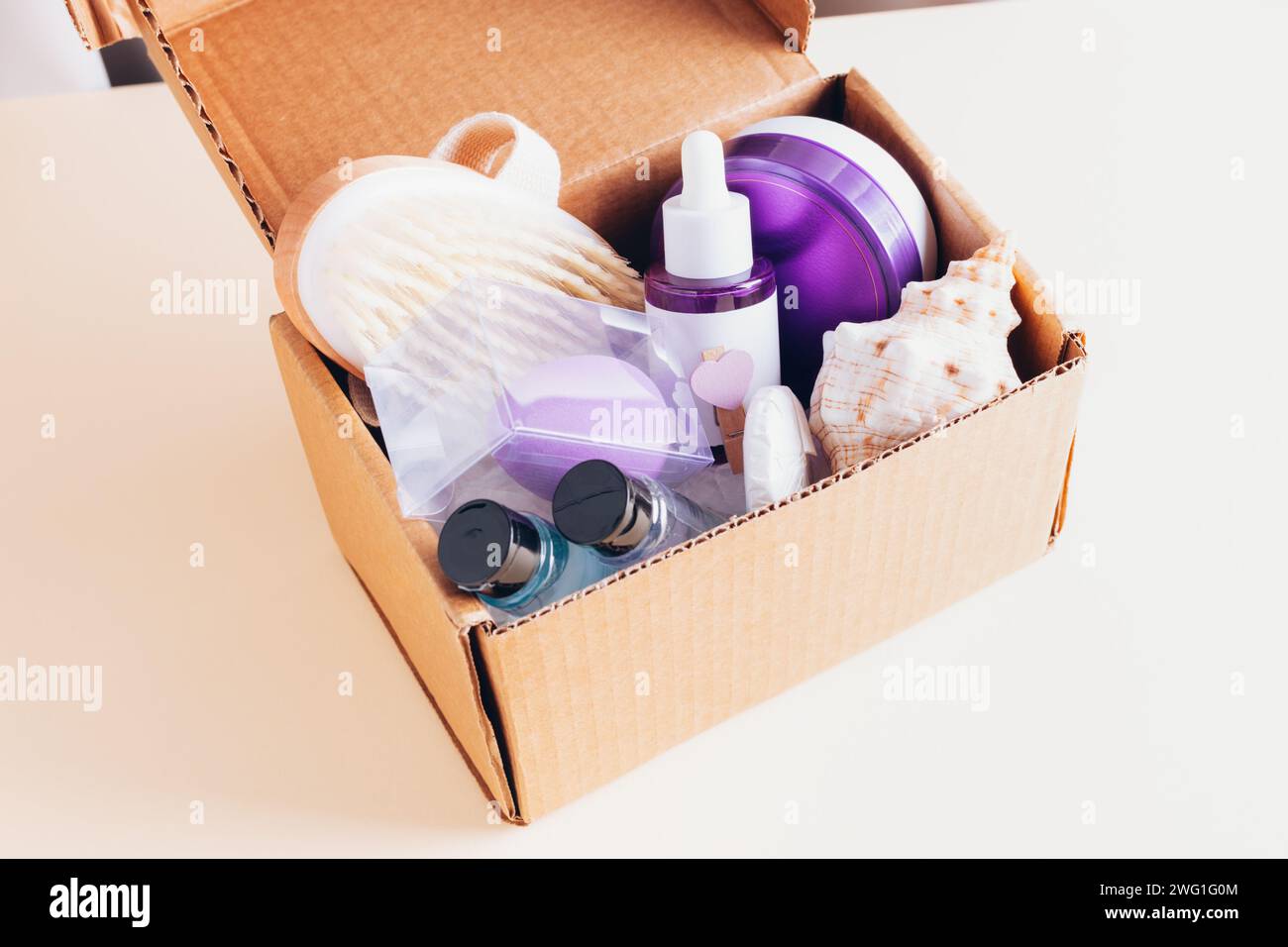 Close-up of cardboard beauty box with different skin care products on ...