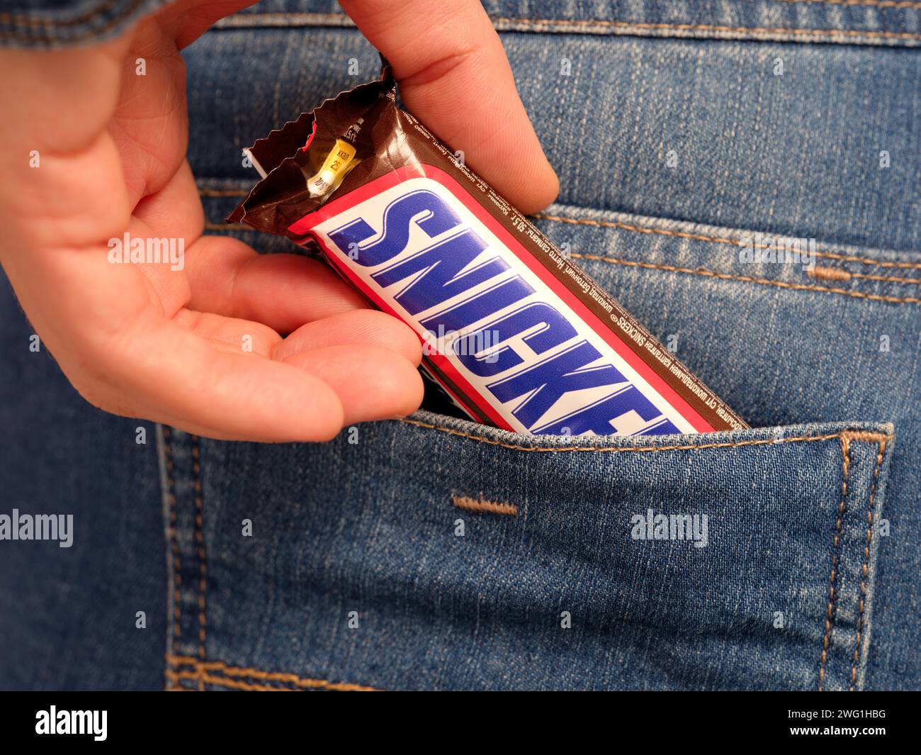 Tambov, Russian Federation - January 23, 2024 A woman hand taking out ...