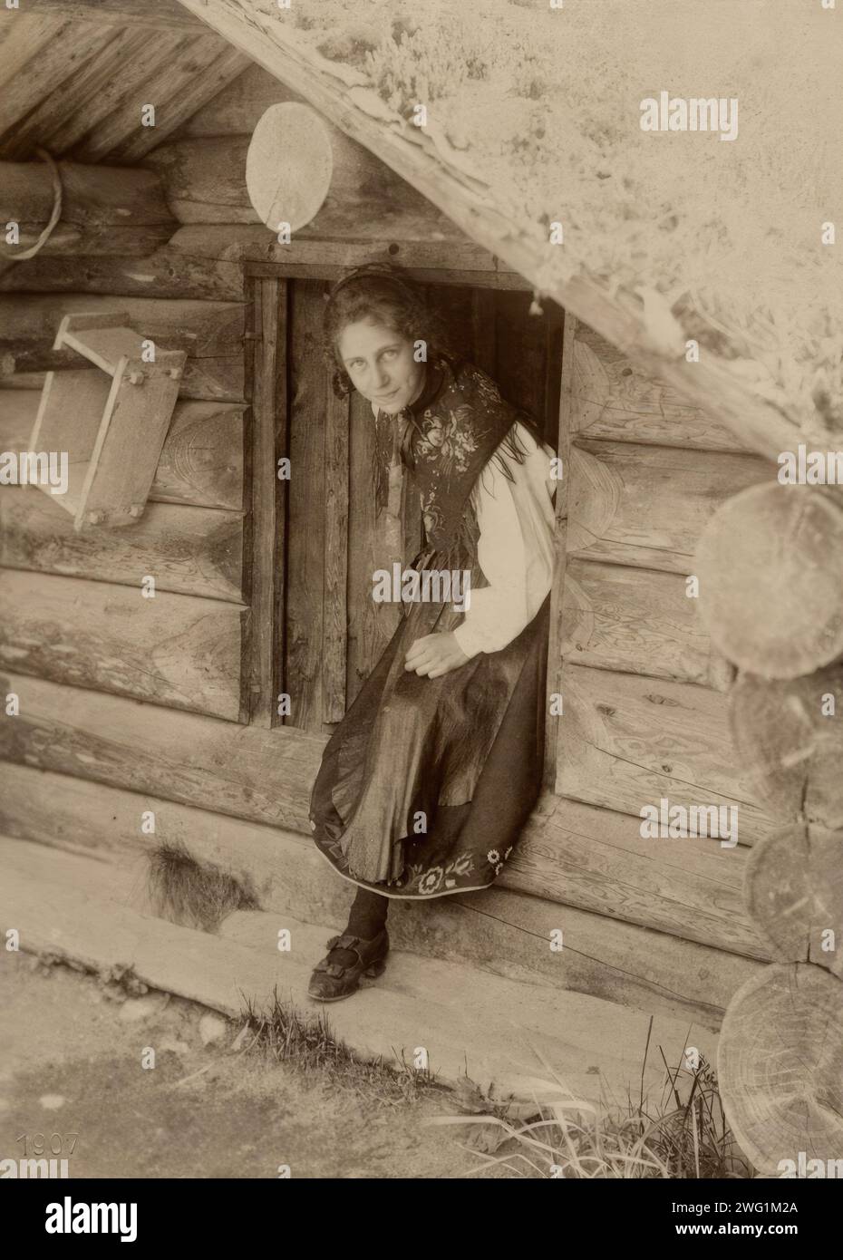 Girl looks out from a doorway, 1890-1920 Stock Photo - Alamy