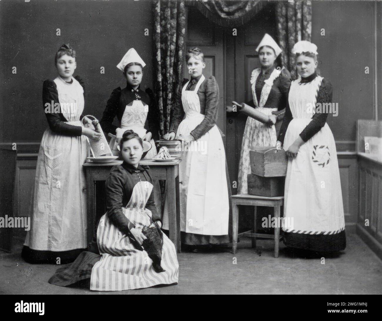 Pupils at Uppsala Housekeeping School, 1890-1899. The girls are dressed ...