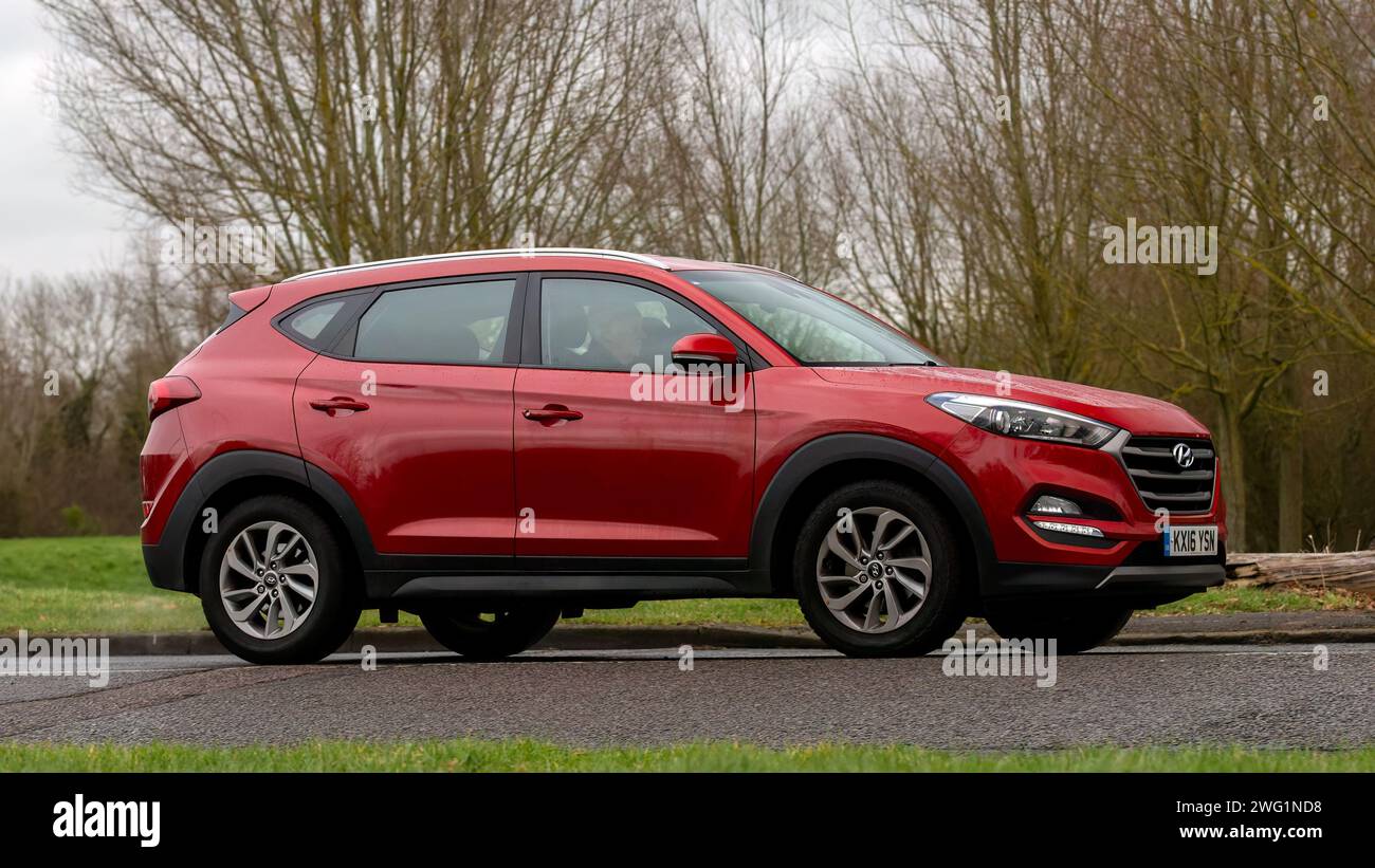 Milton Keynes,UK-Jan 18th 2024: 2016 red Hyundai Tucson car driving on ...
