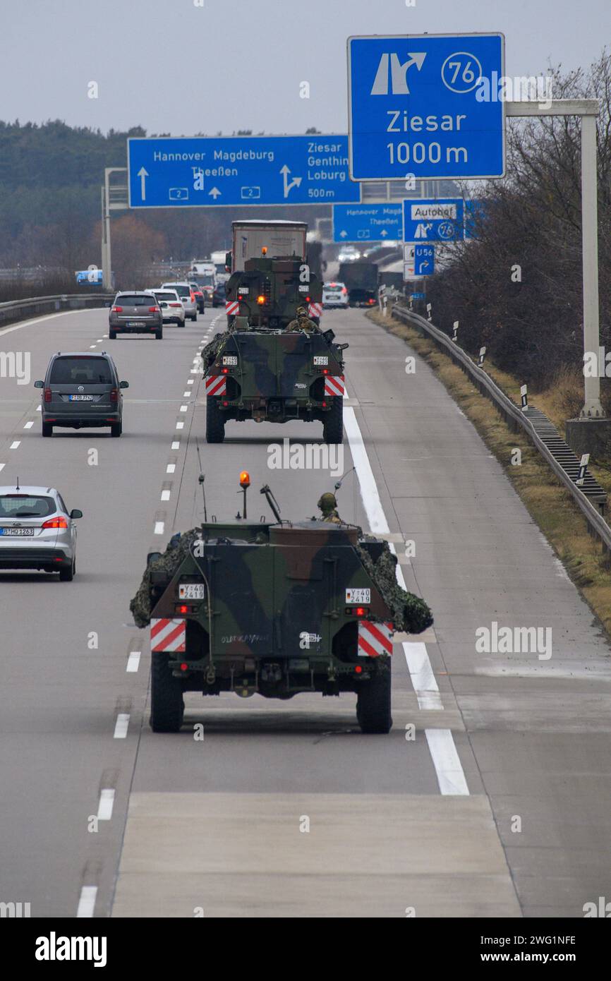 Ziesar, Germany. 02nd Feb, 2024. Bundeswehr vehicles roll along the A2 ...