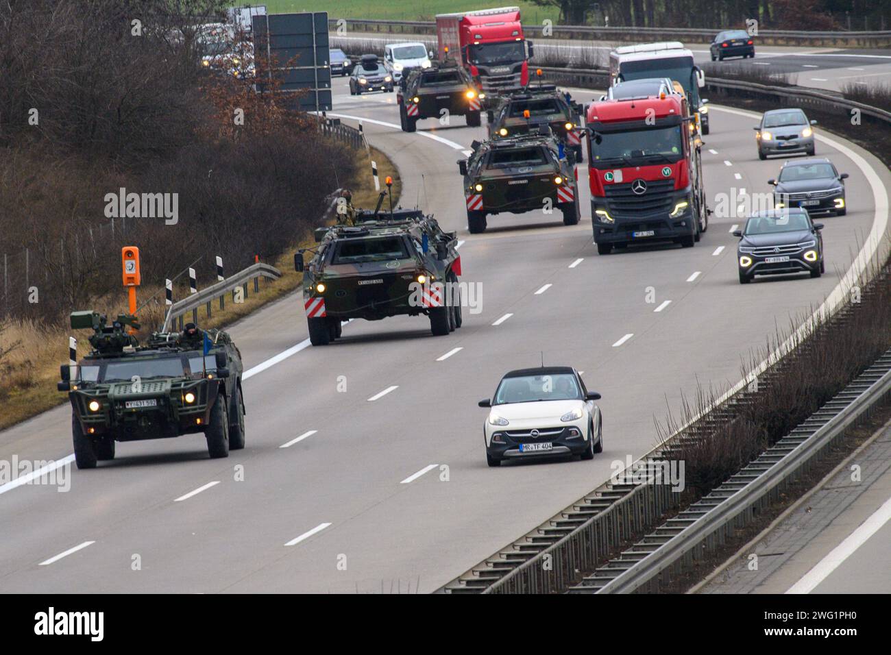 Ziesar, Germany. 02nd Feb, 2024. Bundeswehr vehicles roll along the A2 ...