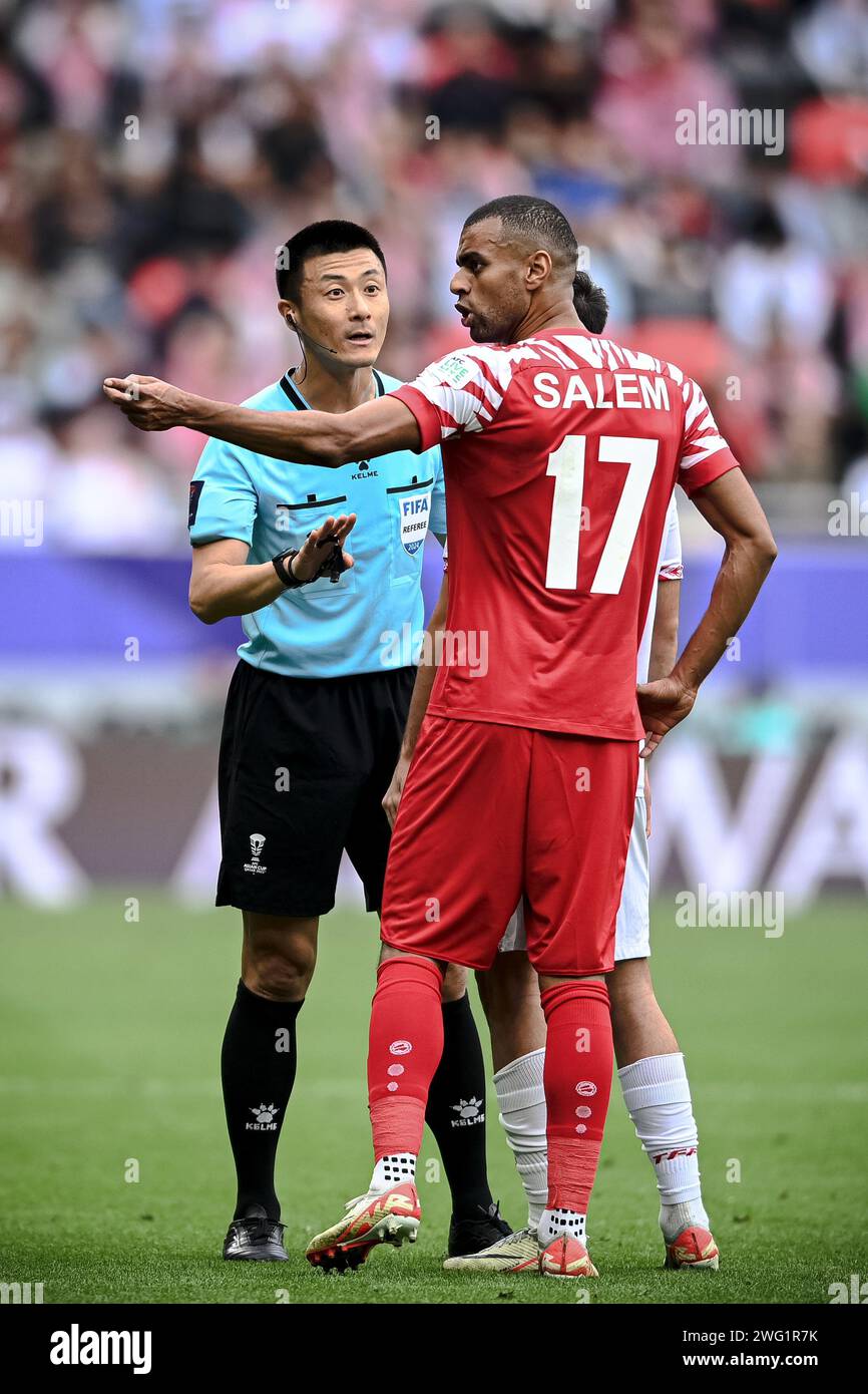 Doha, Qatar. 2nd Feb, 2024. Referee Fu Ming of China talks to Jordan's ...