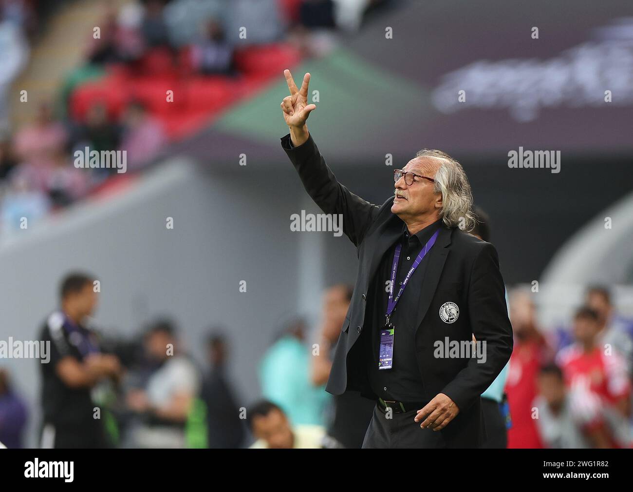Doha, Qatar. 2nd Feb, 2024. Tajikistan's head coach Petar Segrt gives ...