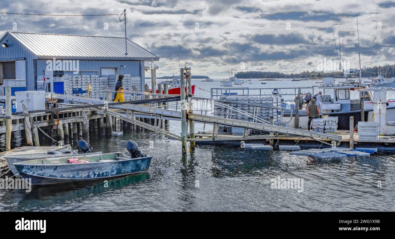Lobster Dock: A fishing boat at a working New England dock unloads ...