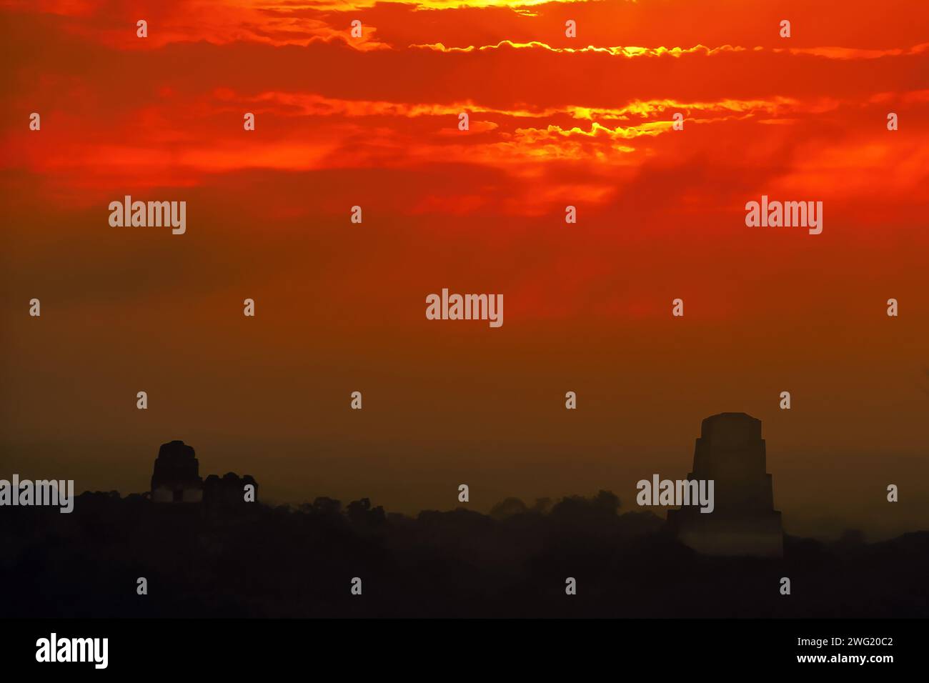 Pyramids of the ancient Maya temple complex of Tikal rising above the ...