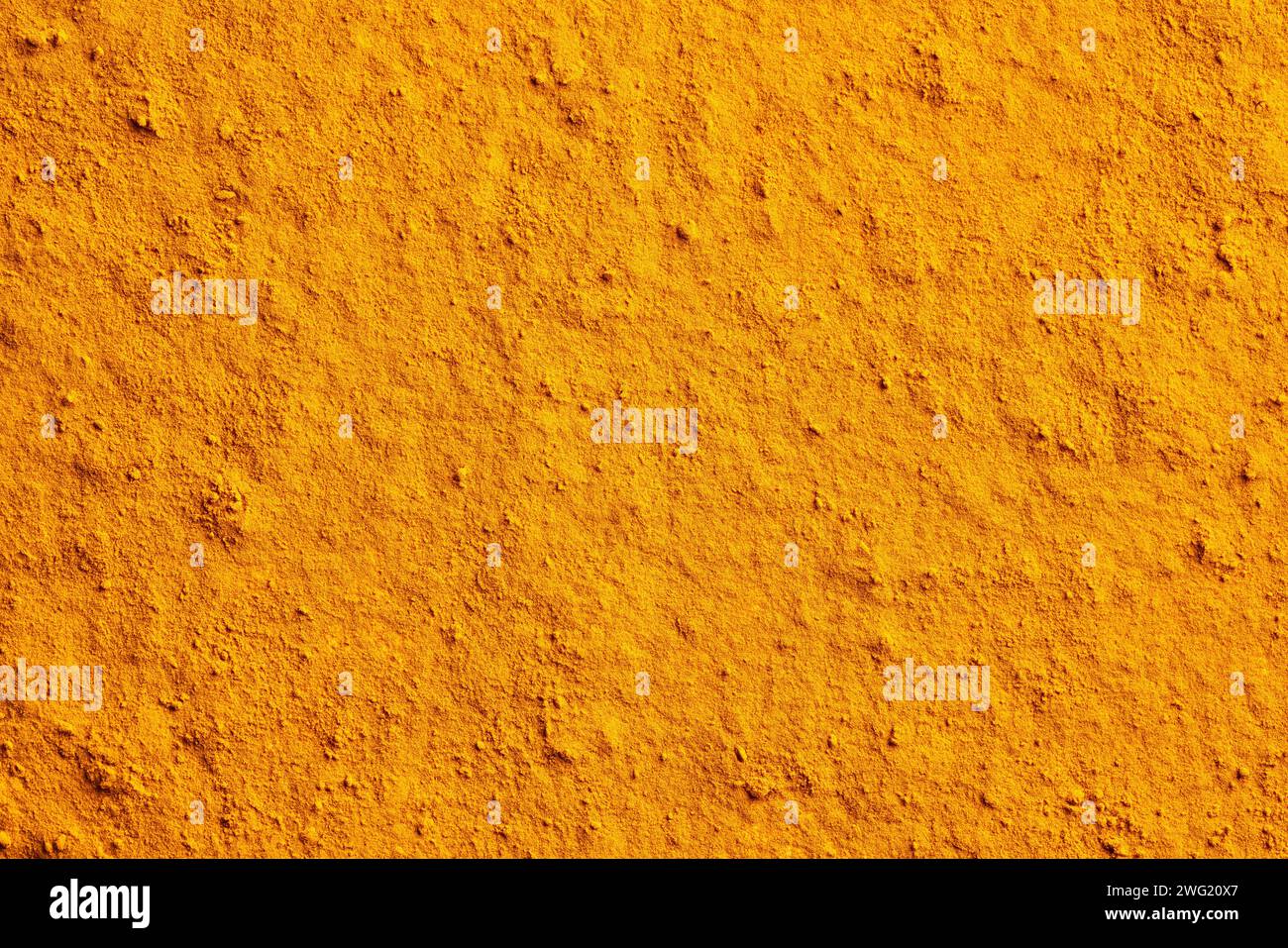 Turmeric powder as a textured background Stock Photo - Alamy