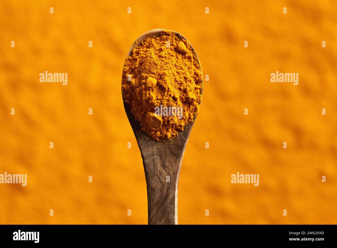 Dry turmeric powder on a spoon, top view Stock Photo - Alamy