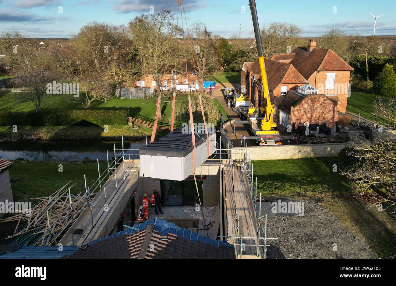A spa pool is removed from an unauthorised spa pool block at the home ...