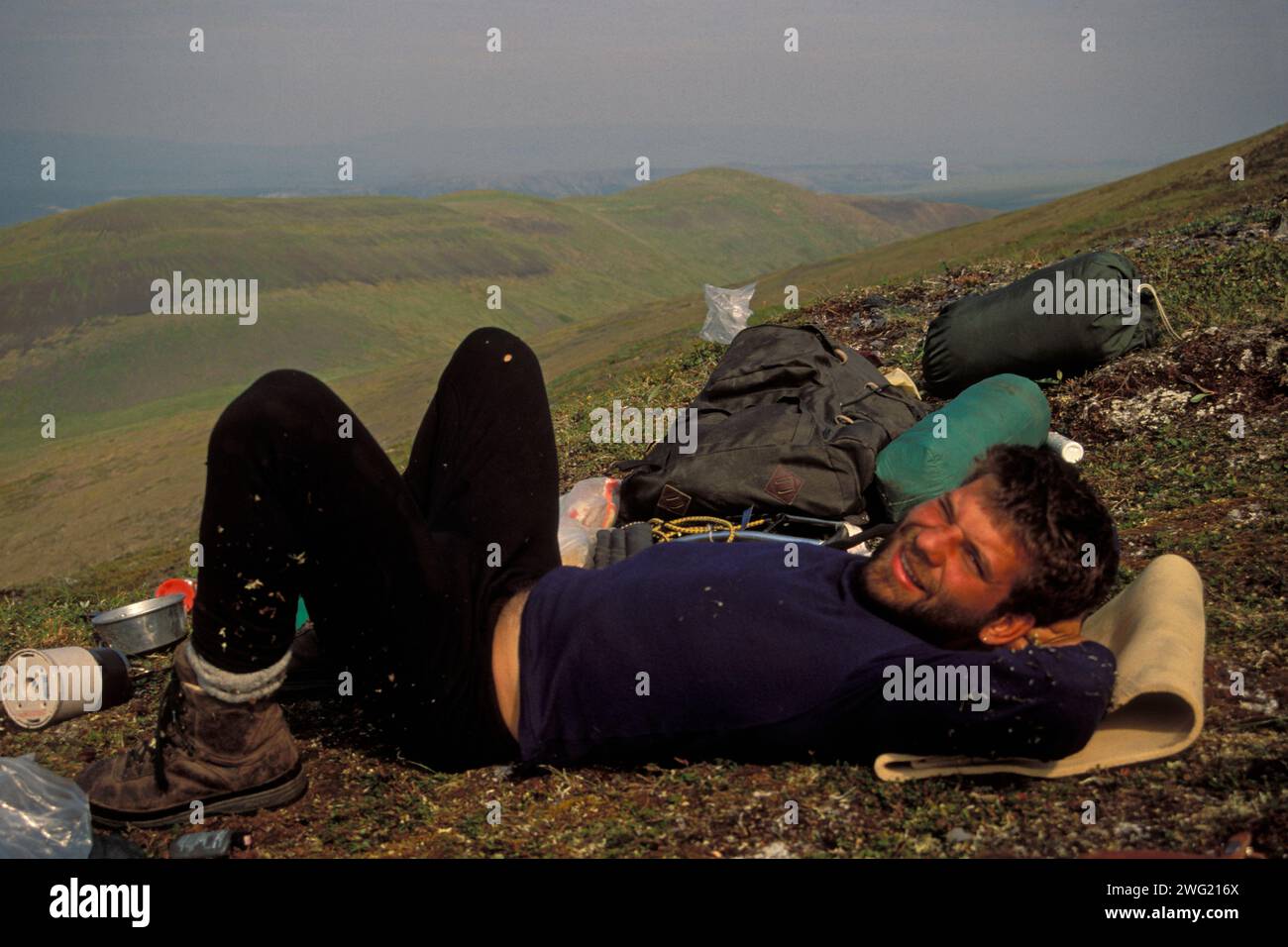 photographer Steven Kazlowski camping out in the Olgilvy mountains ...