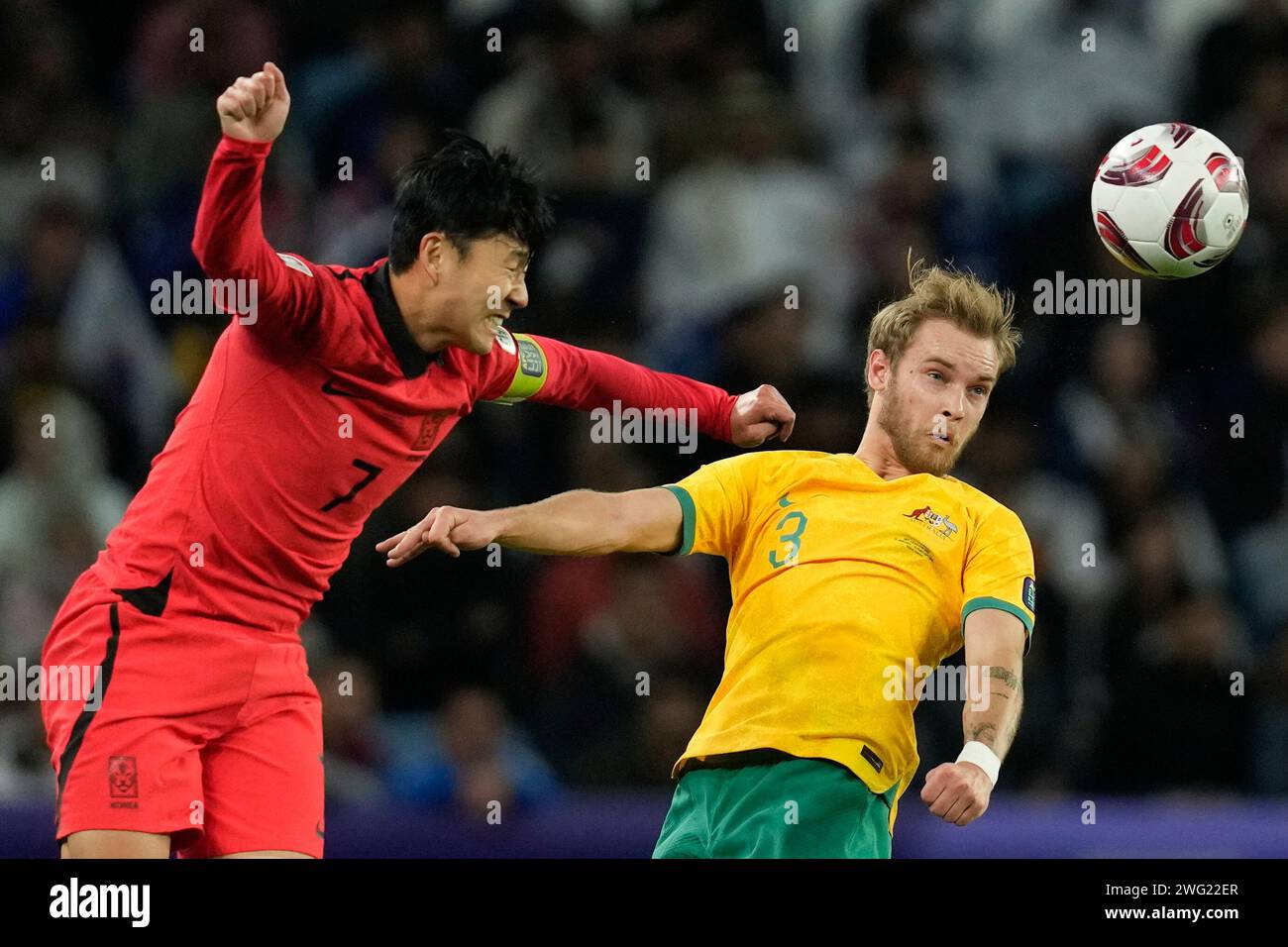 South Korea's Son Heung-min, left, and Australia's Nathaniel Atkinson ...