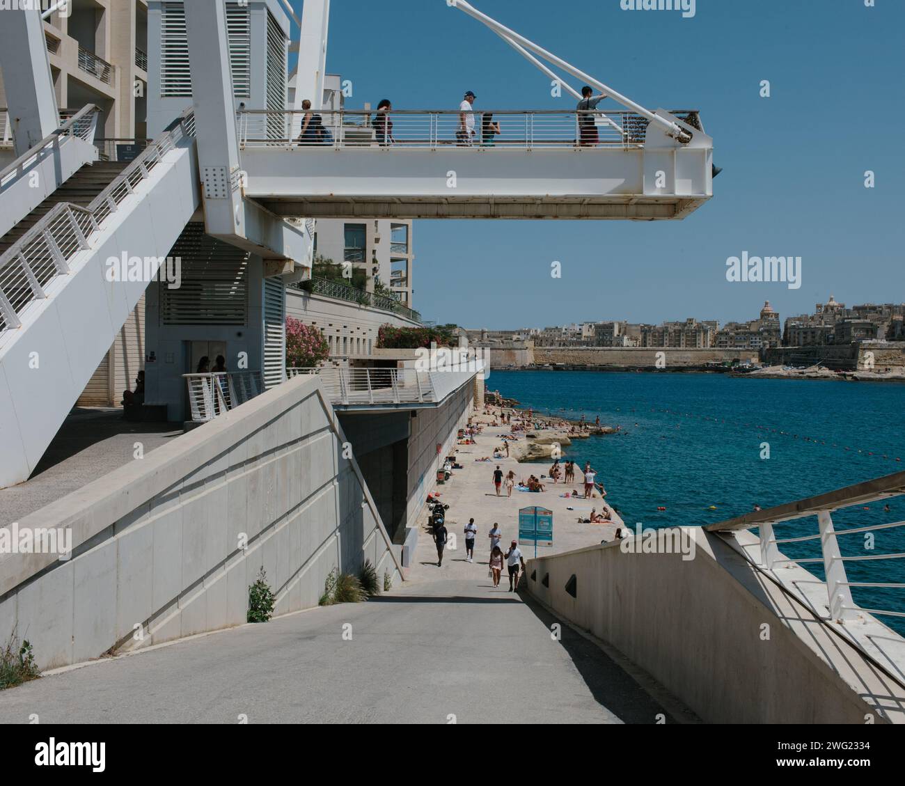 A view of Tigne Point beach in Malta in summer Stock Photo - Alamy
