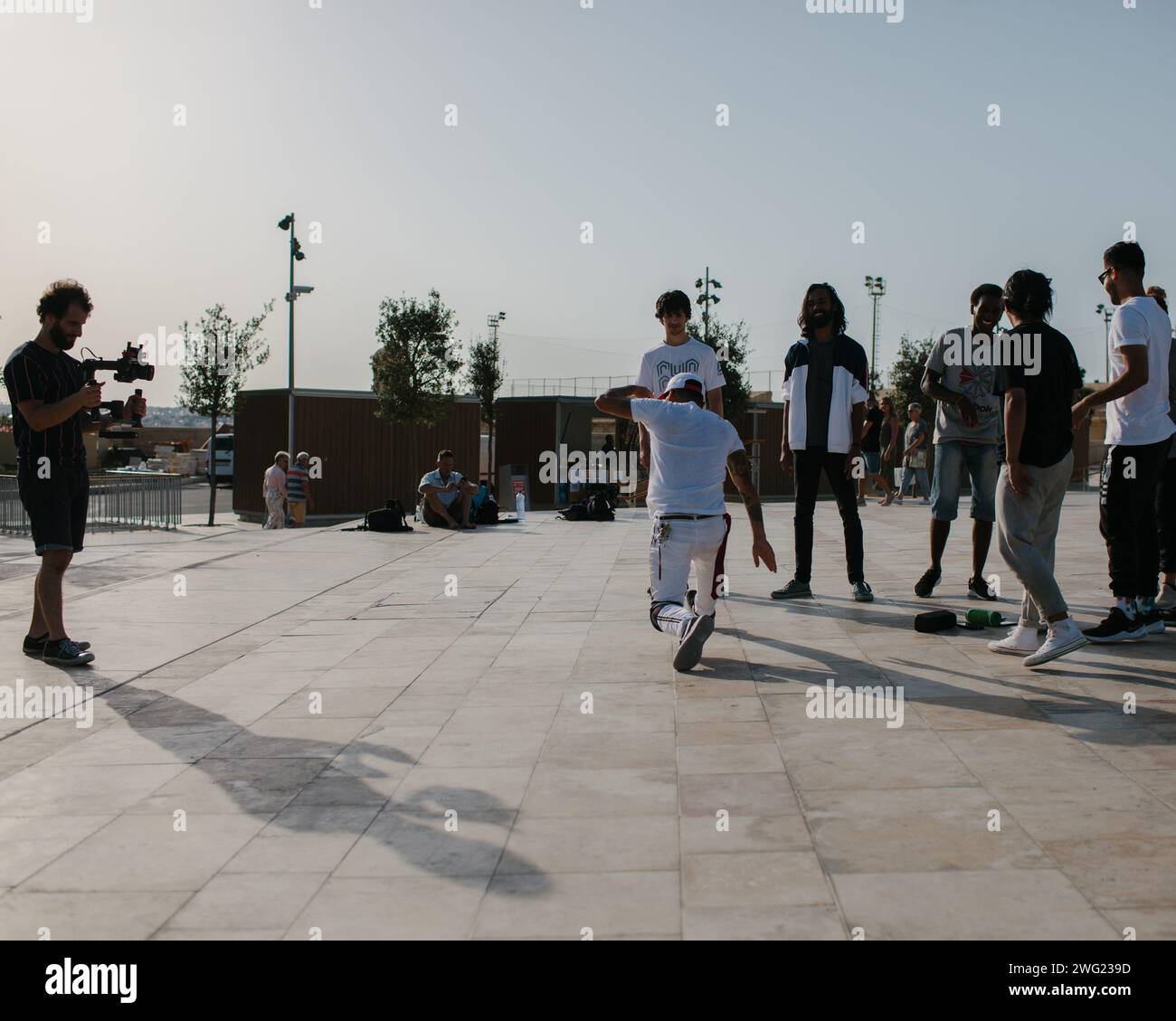A street dance troop can be seen film a dance video near Tigne Point in ...