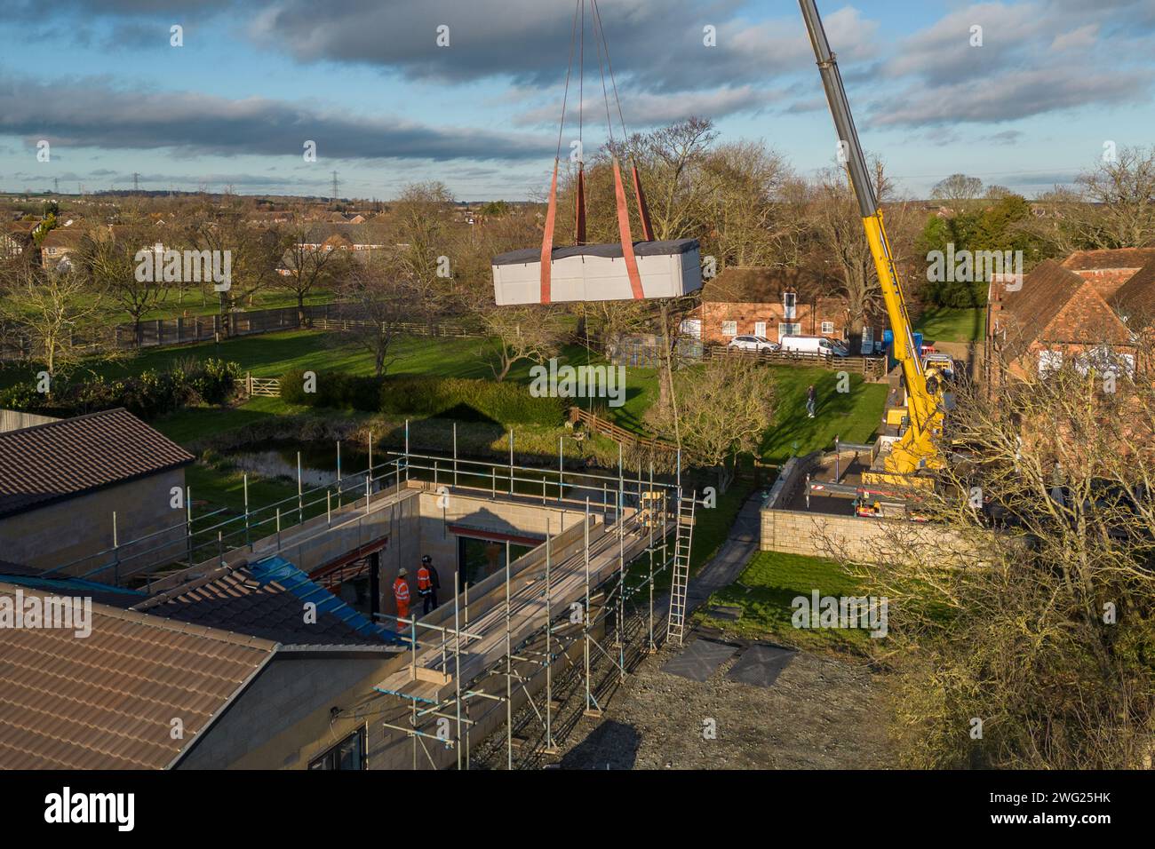 A spa pool is removed from an unauthorised spa pool block at the home ...