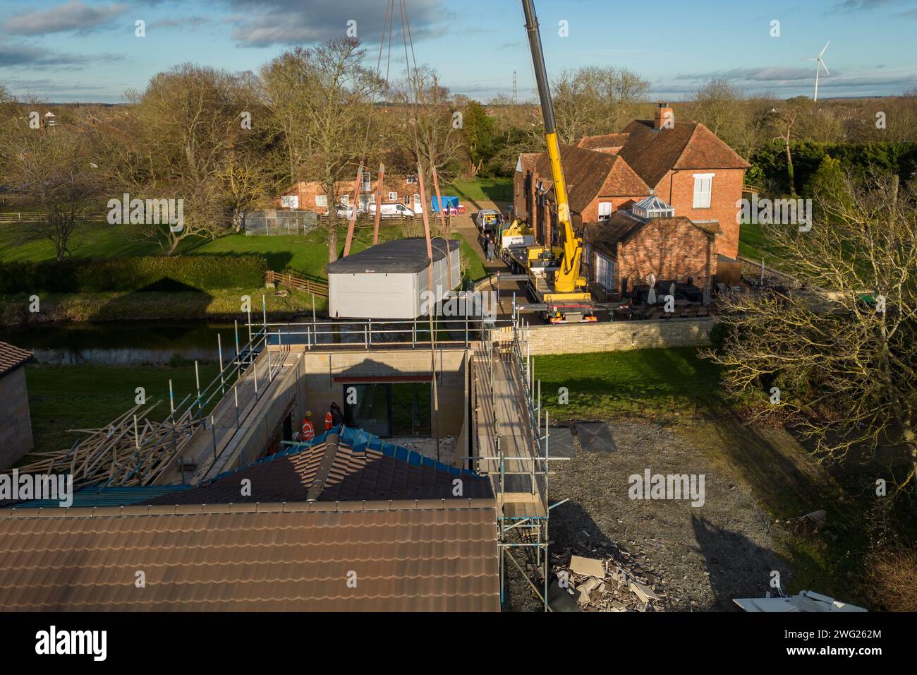 A spa pool is removed from an unauthorised spa pool block at the home ...