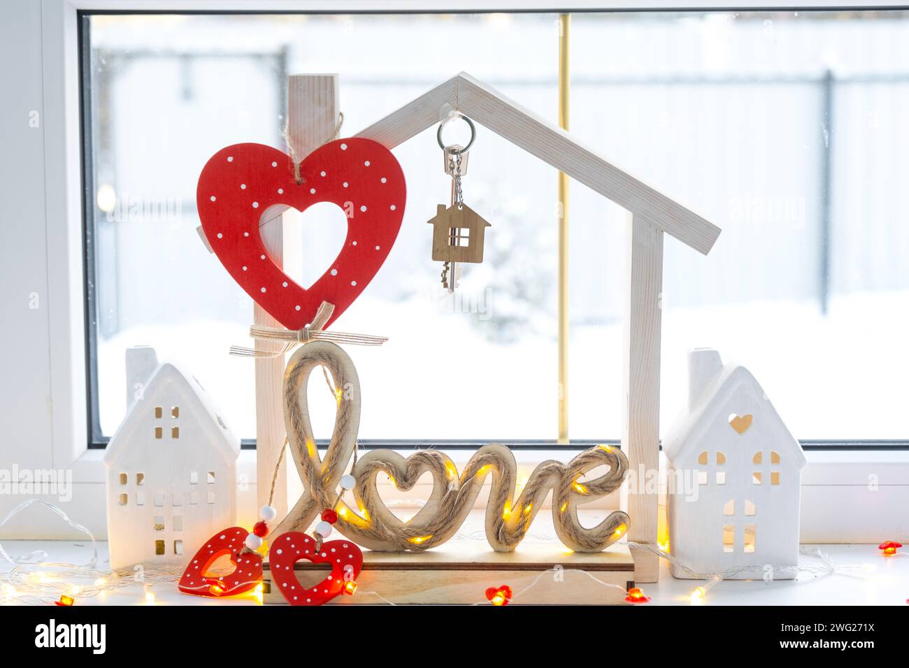 Key to tiny house of cozy home with Valentine decor on the windowsill ...