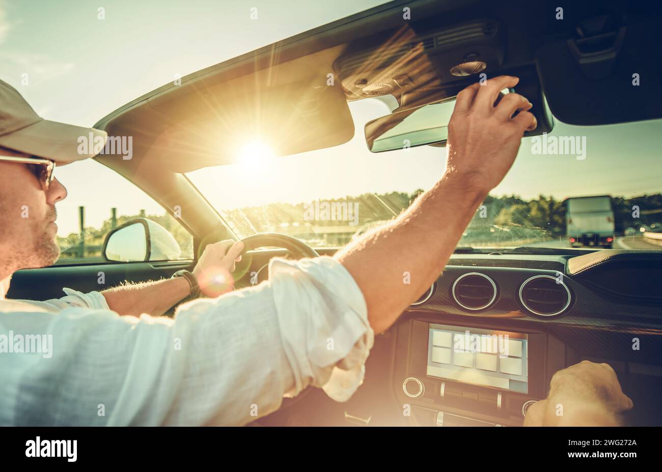 Caucasian Man Convertible Car Driving During Scenic Sunset. Automotive ...