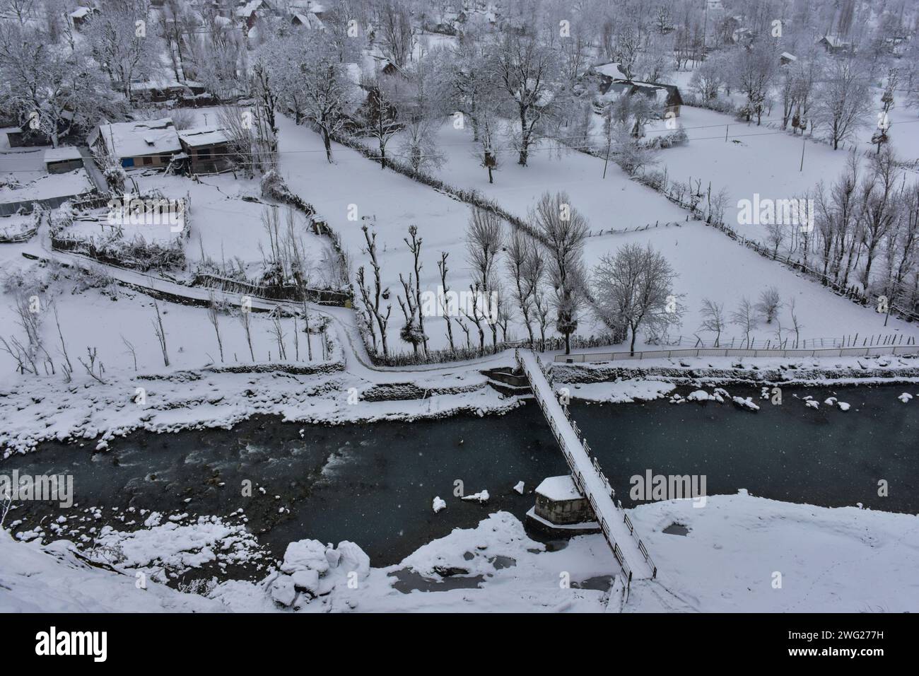 Sonamarg, India. 02nd Feb, 2024. Snow covered bridge and residential ...