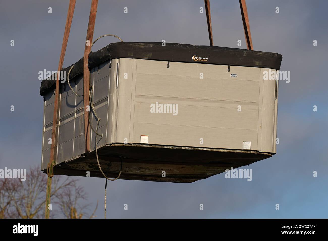 A spa pool is removed from an unauthorised spa pool block at the home ...