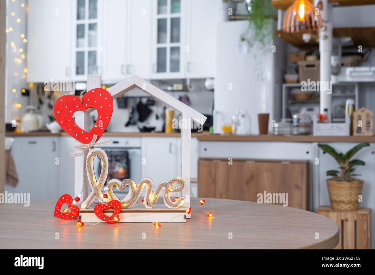 Key to tiny house of cozy home with Valentine decor on table of kitchen ...