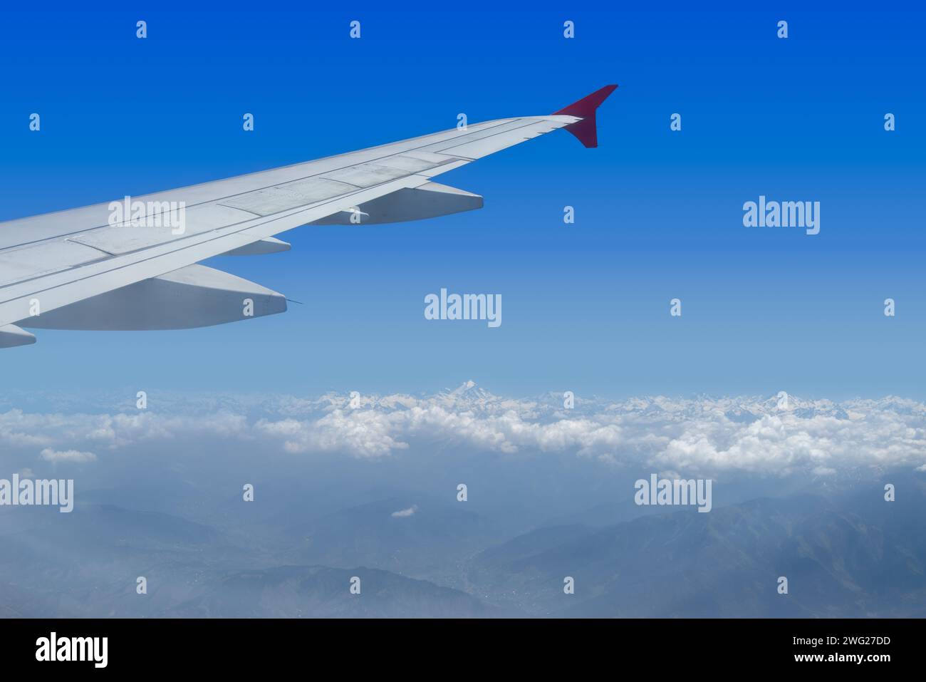 View of the wing from a window in the passenger cabin of an airplane ...