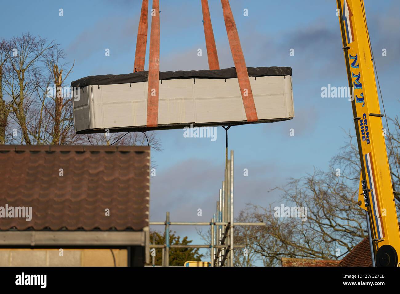 A spa pool is removed from an unauthorised spa pool block at the home ...