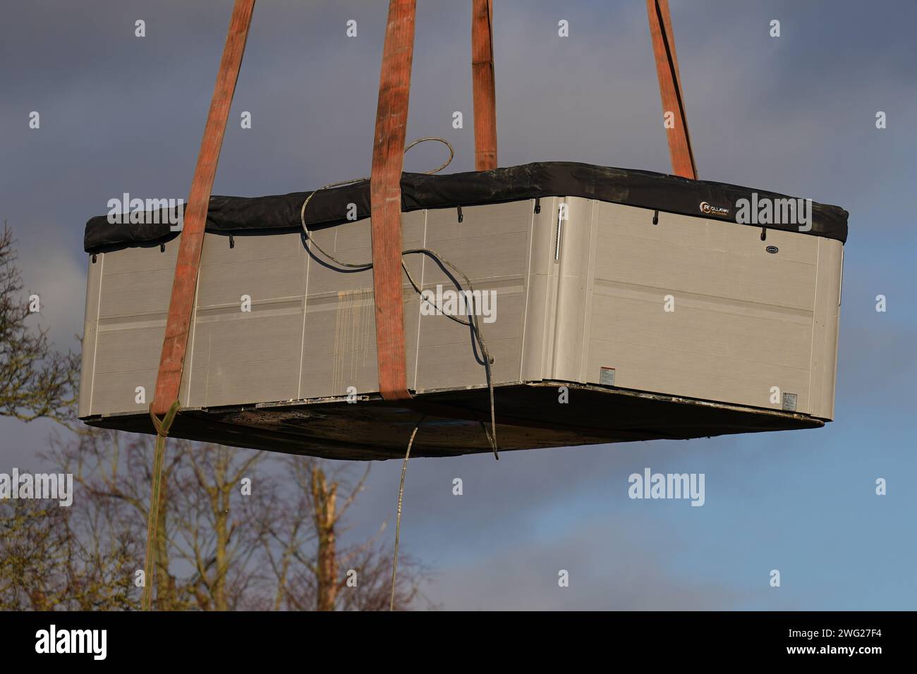 A spa pool is removed from an unauthorised spa pool block at the home ...
