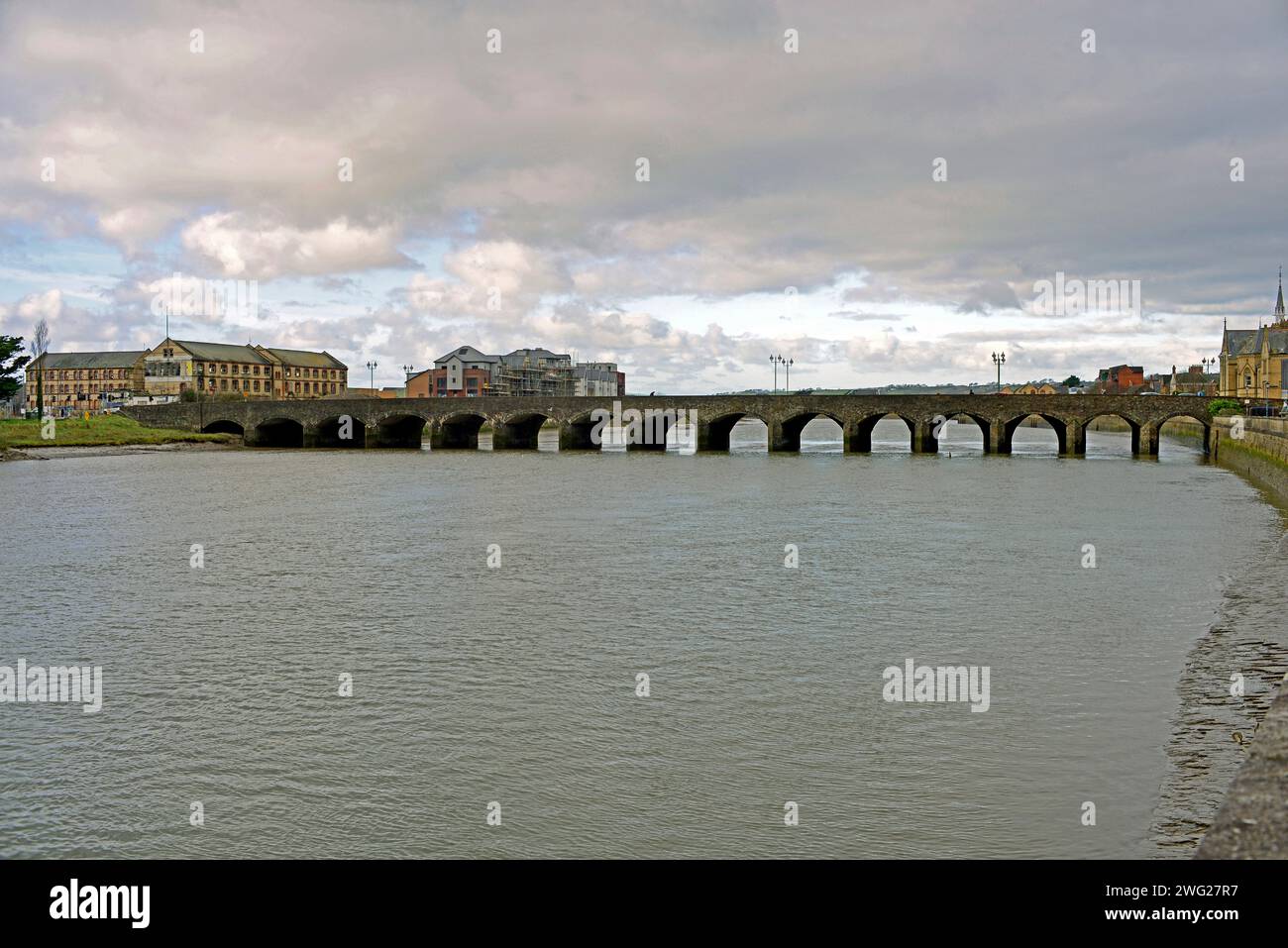 Long Bridge spans the River Taw in Barnstaple North Devon. The river is ...