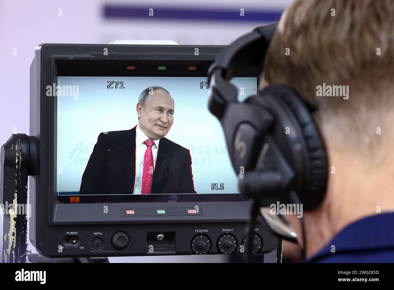 Russian President Vladimir Putin is seen on the a TV camera screen as ...
