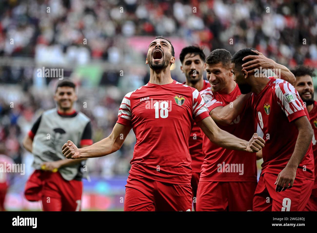 Doha, Qatar. 2nd Feb, 2024. Jordan's Saleh Ratib (front) celebrates ...