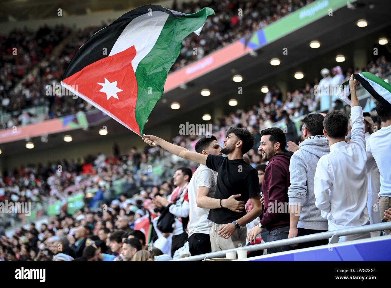 Doha, Qatar. 2nd Feb, 2024. Supporters of team Jordan cheer for the ...