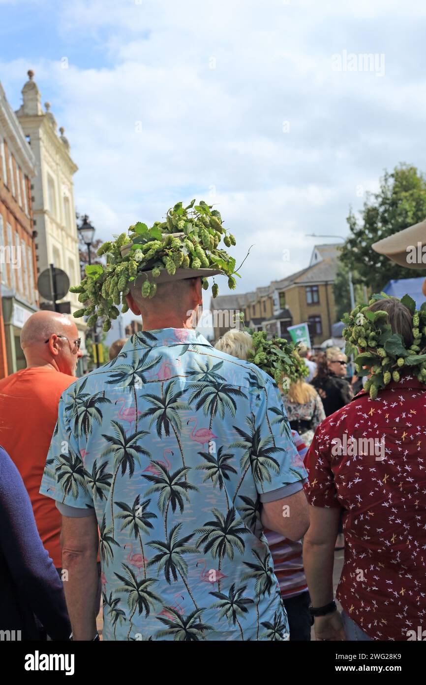 Crowds wearing hops around their hats at Faversham Hop Festival ...