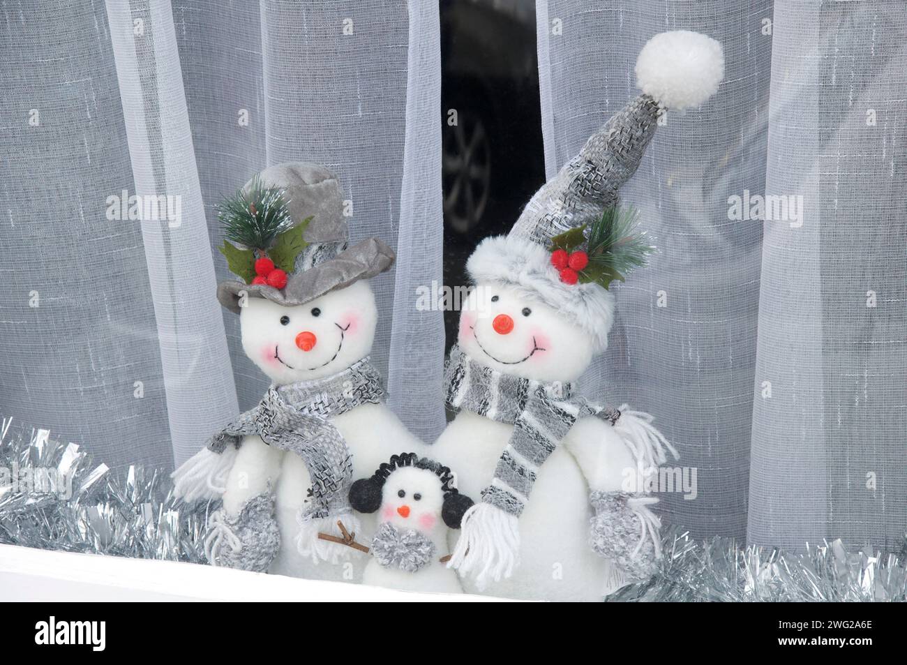 Cute quirky Christmas decorations. A cuddly snowman family, with mummy ...