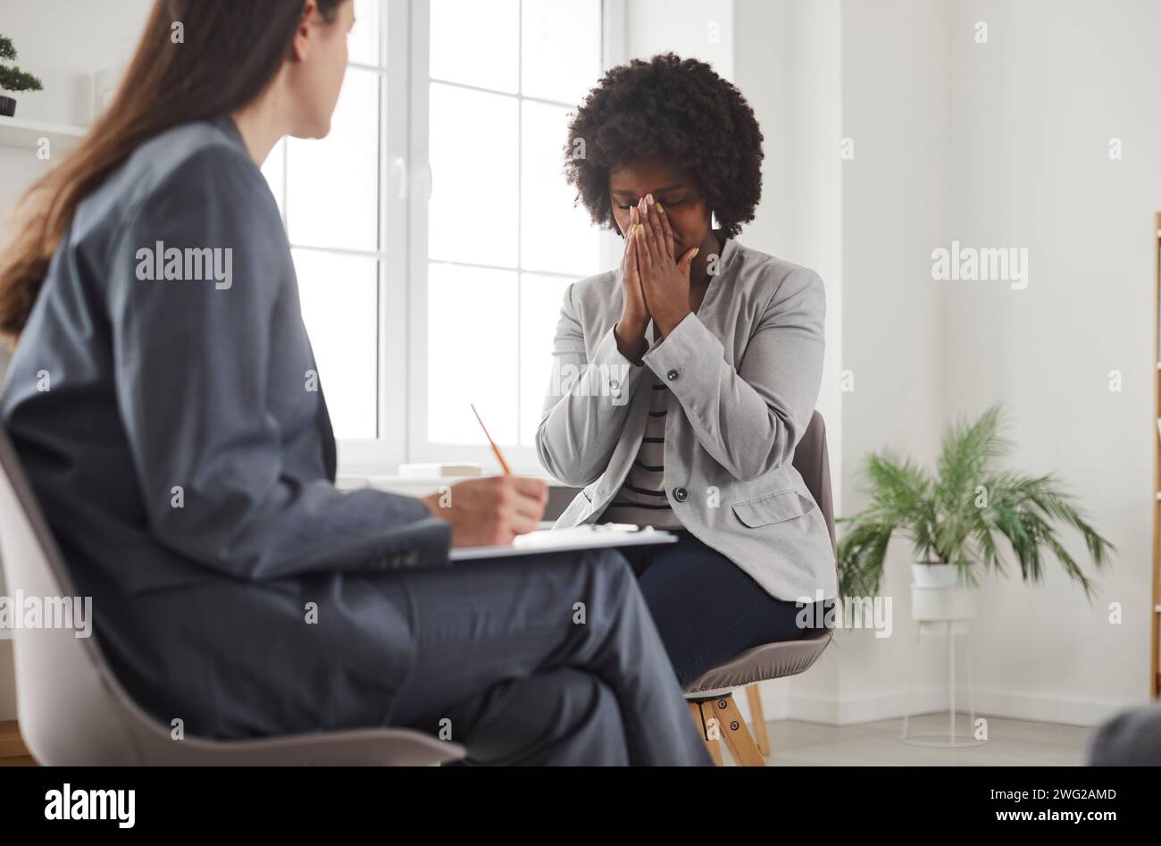 Woman crying during therapy session hi-res stock photography and images ...
