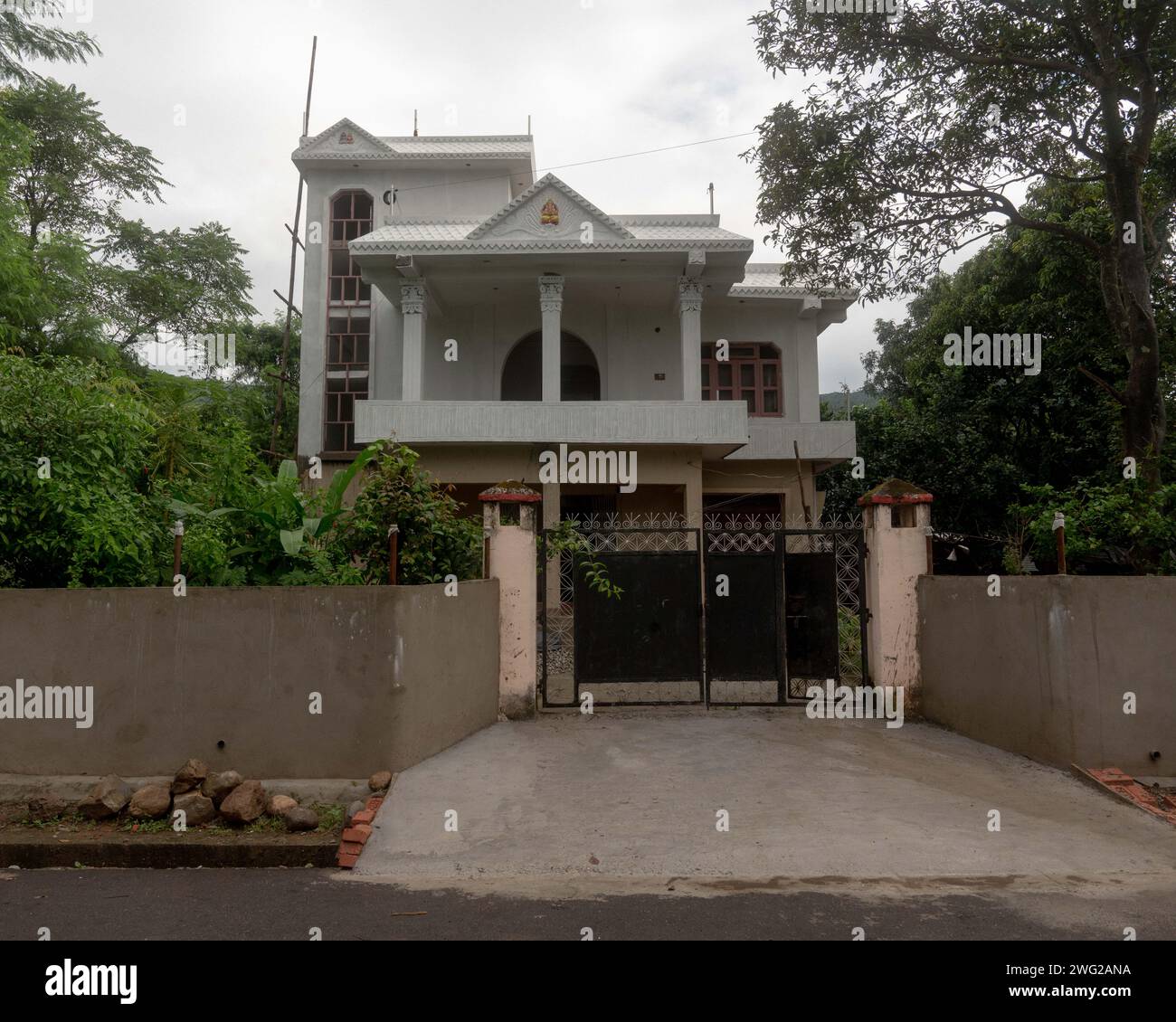 A typical Nepali home, painted white, in Birendranagar, Western Nepal ...