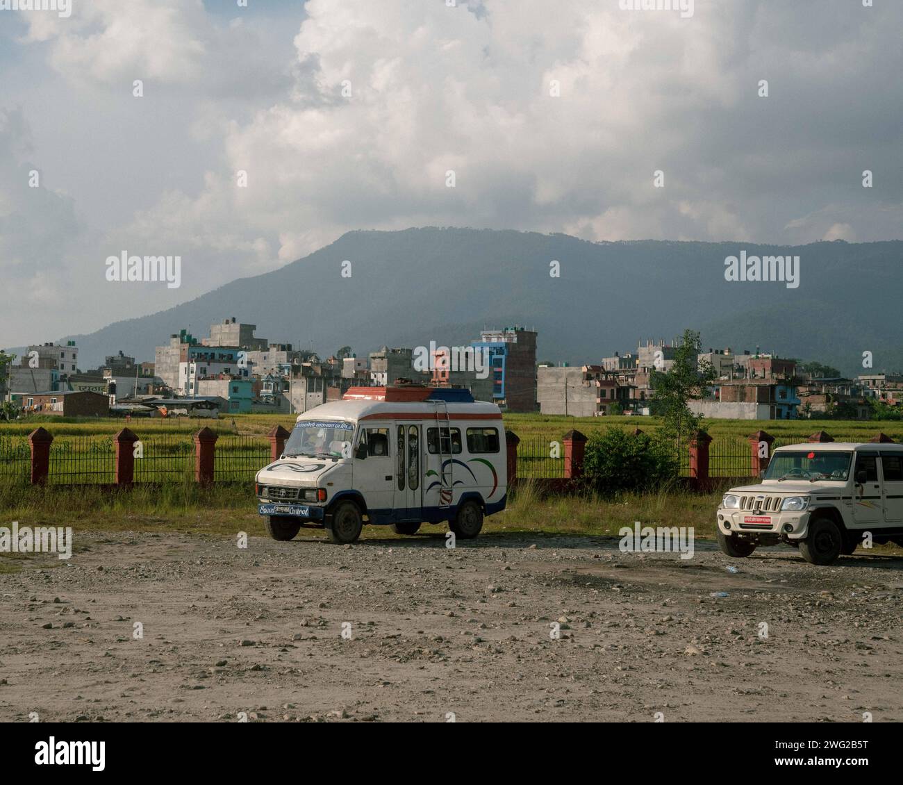 A typical Nepali bus parked at the edge of the city, in Birendranagar ...