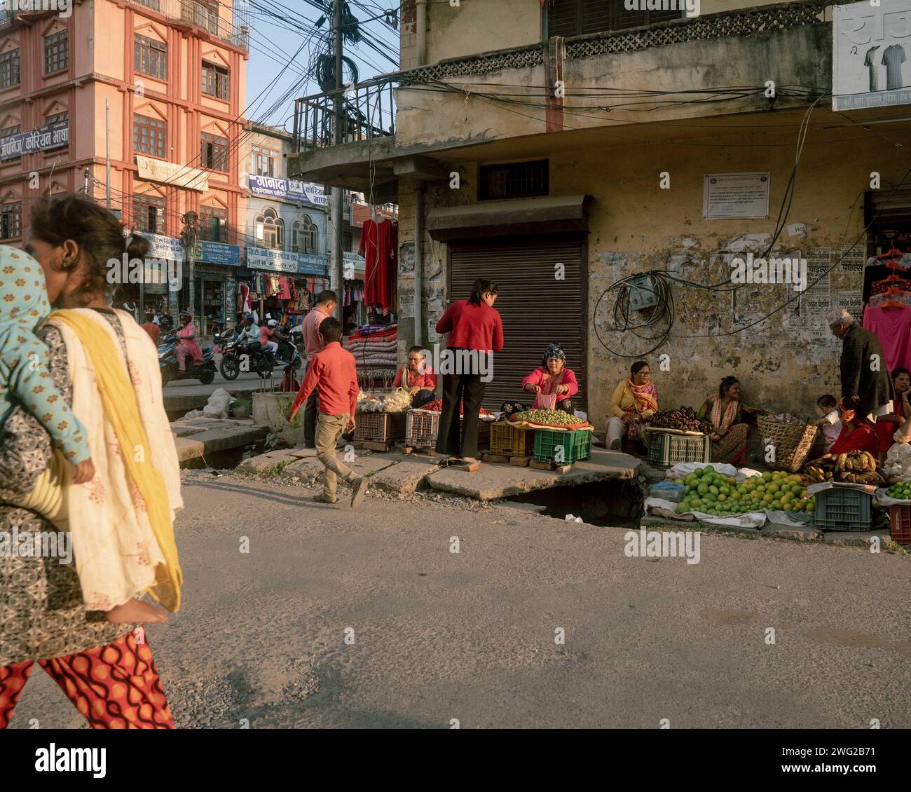 Nepali women selling groceries at the side of the road. A typical ...