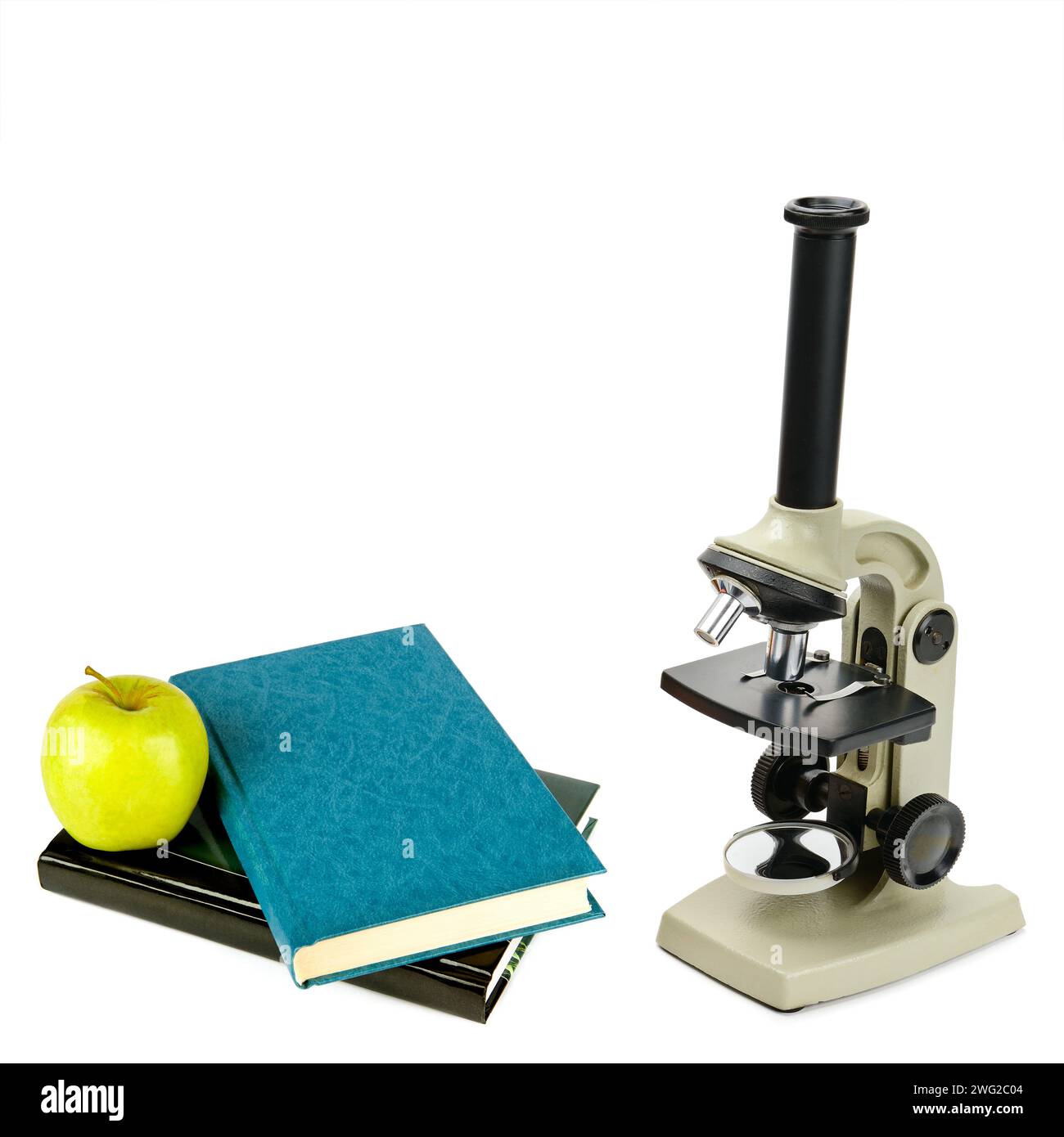 Laboratory microscope and books isolated on white background. There is ...
