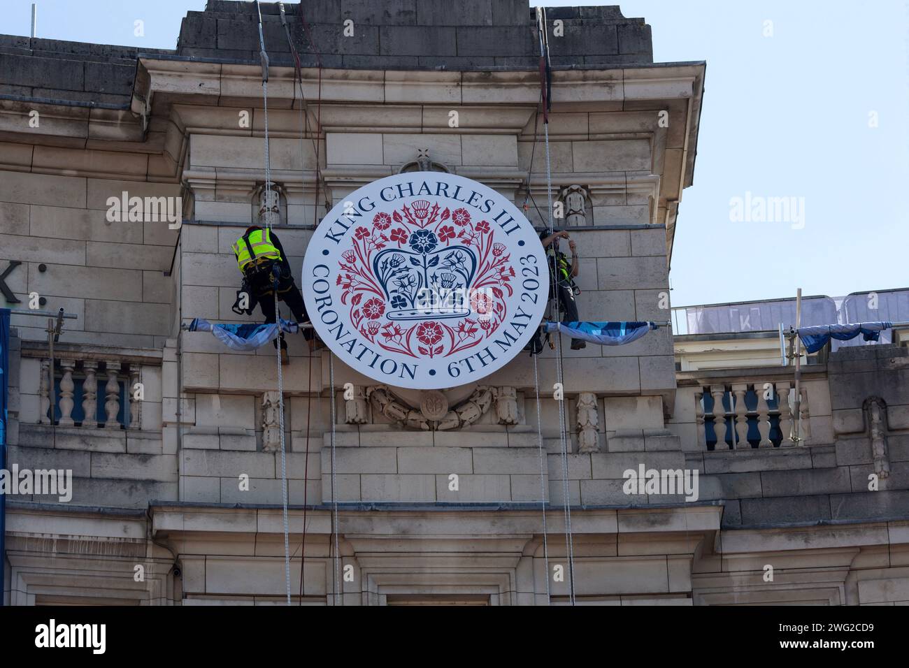 The coronation emblem of King Charles III is installed on the Admiralty ...