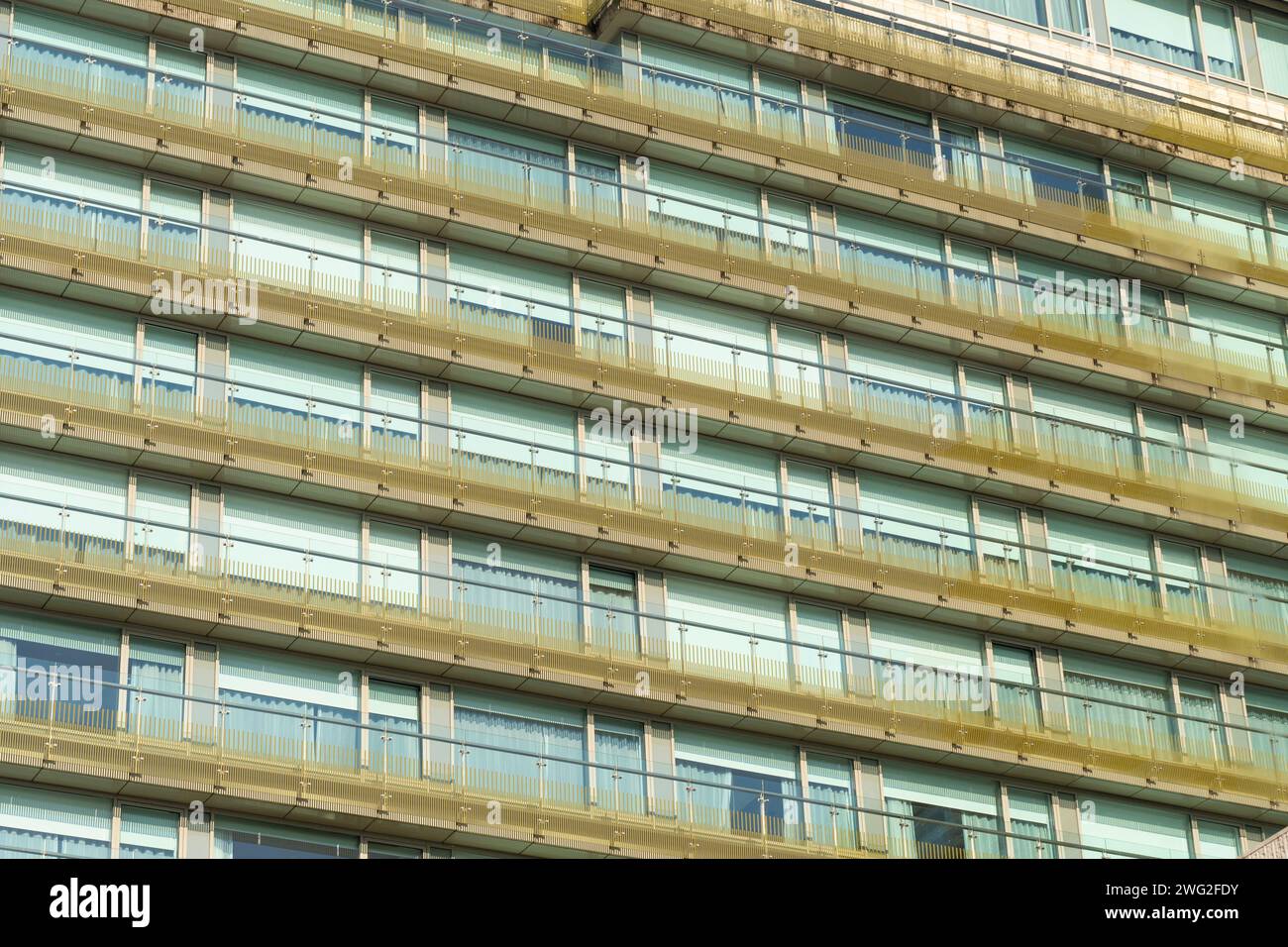 Modern skyscraper with glass covered balconies Stock Photo - Alamy