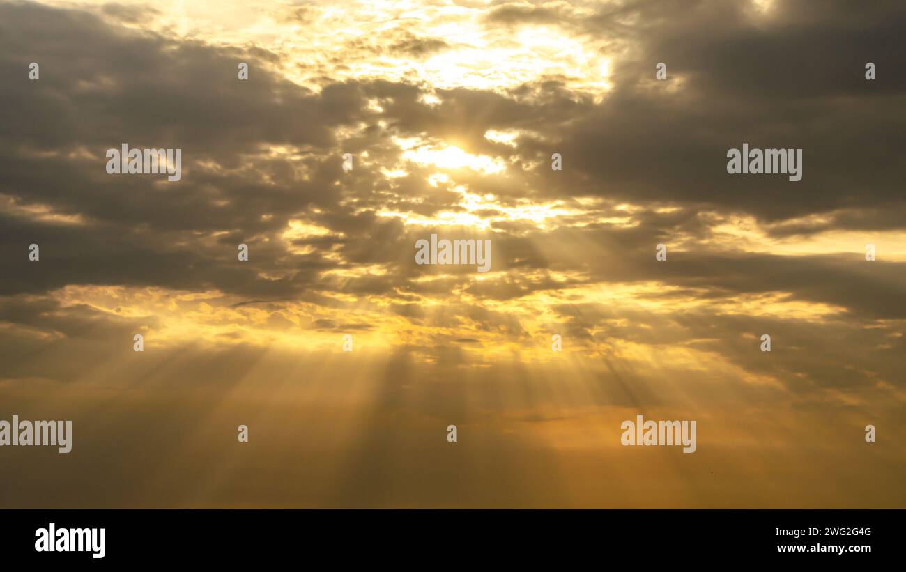 Cloudy sky with golden sunset hi-res stock photography and images - Alamy