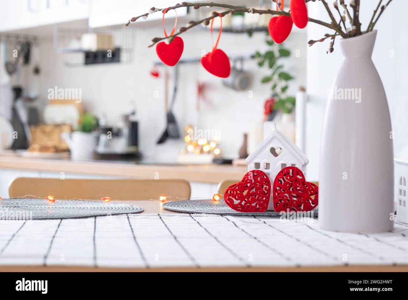The interior of the kitchen in the house is decorated with red hearts ...