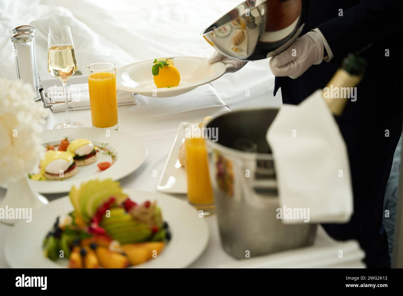 Waiter serves guest hi-res stock photography and images - Alamy